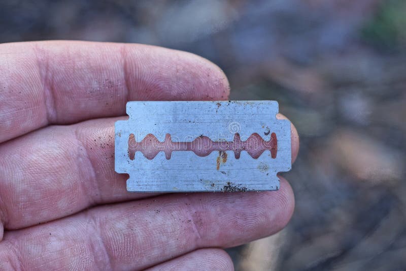Fingers Holding a Razor with a Gray Iron Blade Stock Photo - Image of ...