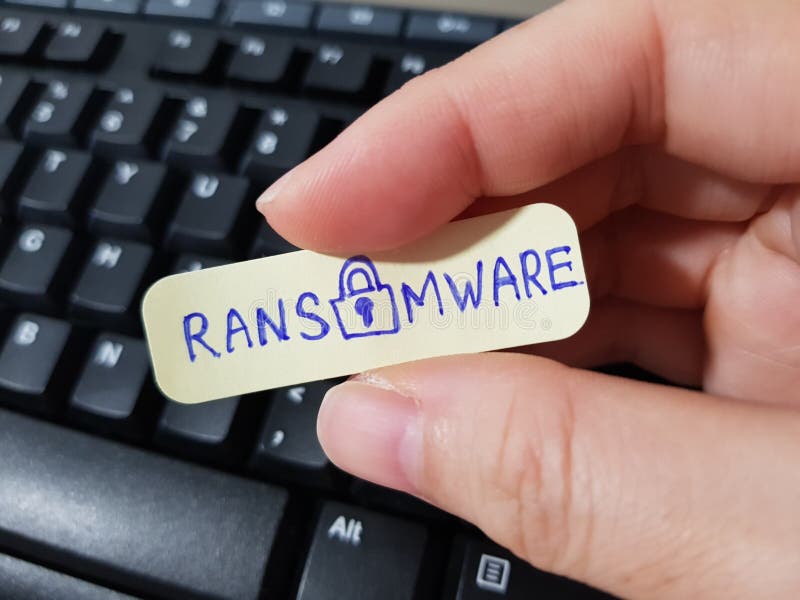 Fingers Holding Sticky Note with Word RANSOMWARE Stock Photo - Image of ...