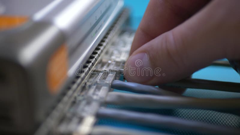Fingers Plugging Ethernet Cable with Rj45 into Port of Ethernet Router ...