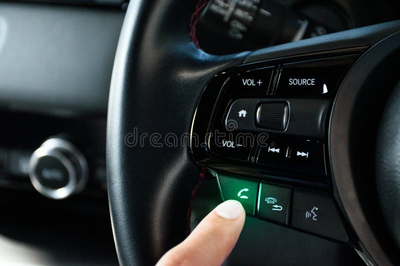 Fingers Pressing the Answer Call Button on the Car Steering Wheel with ...