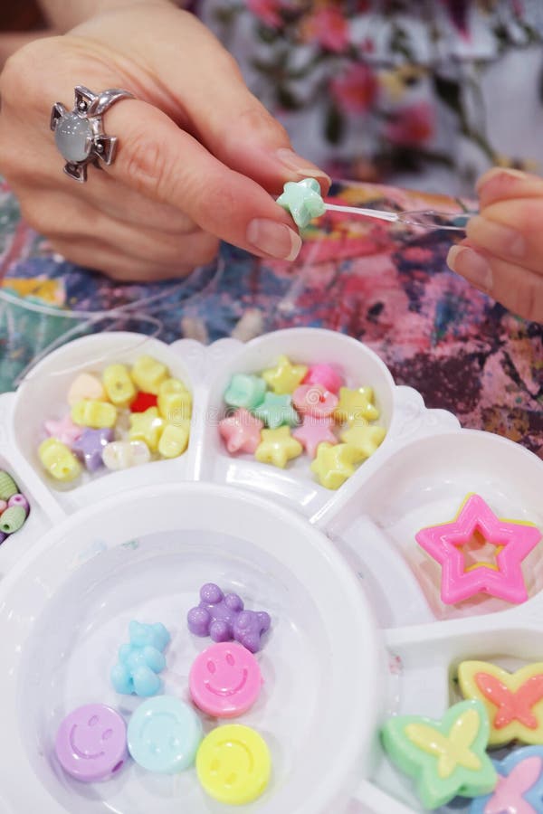 Fingers Putting Bead on String for Making Beaded Accessories Stock ...