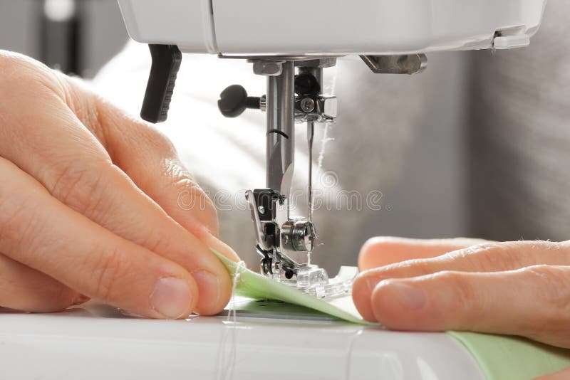 Fingers of the Seamstress Working on the Sewing Machine Stock Photo ...