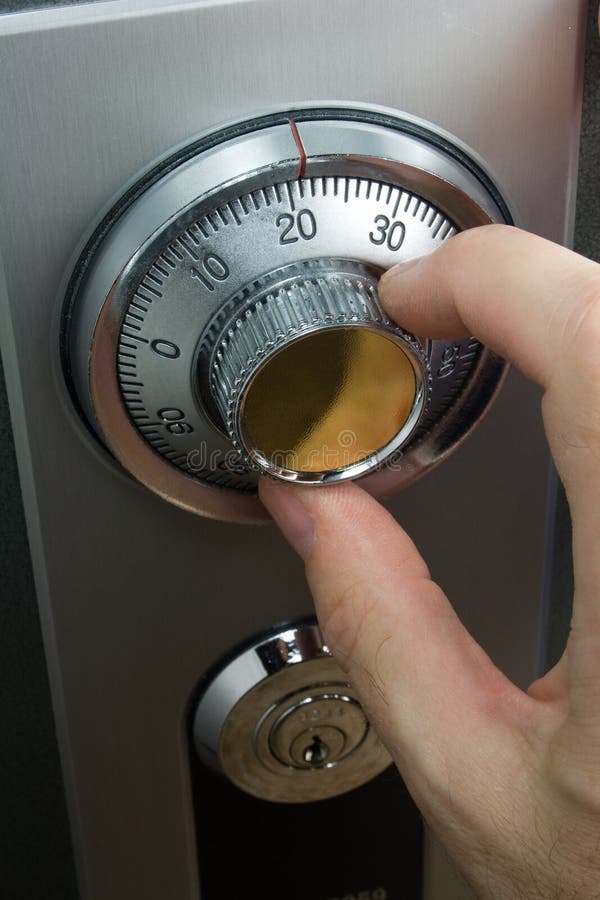 Fingers Turning Safe Dial stock image. Image of proof - 21531701