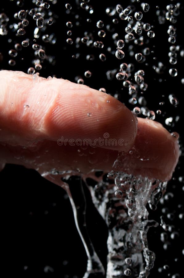 Fingers in water drops stock photo. Image of black, colors - 51943294