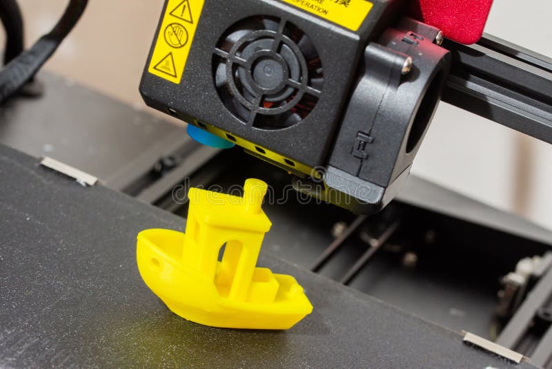 Finished 3D Printed Model of Yellow ABS Ship. Detail of Printhead with ...