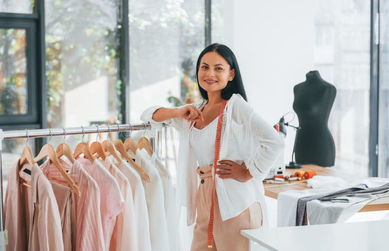 With Finished Product. Seamstress is in Her Office that is with ...