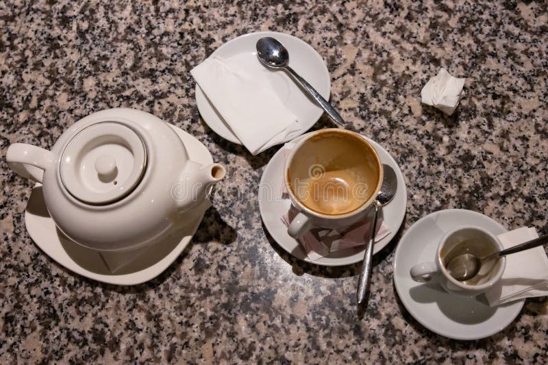 Finished Tea Break with an Empty Cup and Teapot on a Granite Table ...