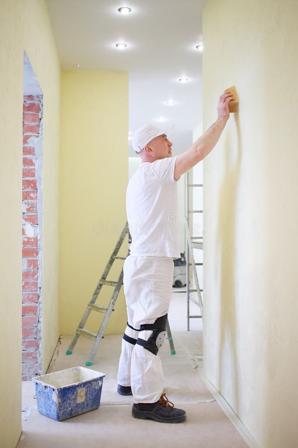 Finisher Polishing the Wall Using a Sanding Stock Image - Image of ...