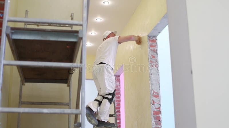 Finisher is Standing on Stepladder and Polishing Stock Video - Video of ...