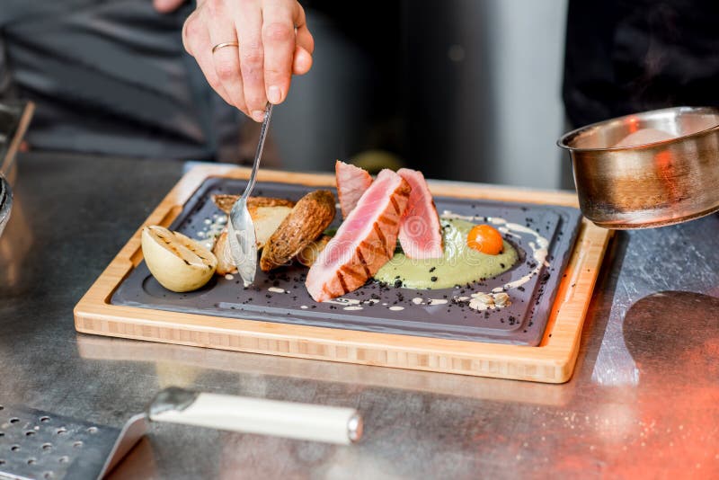 Finishing delicious dish stock image. Image of hands - 86222865