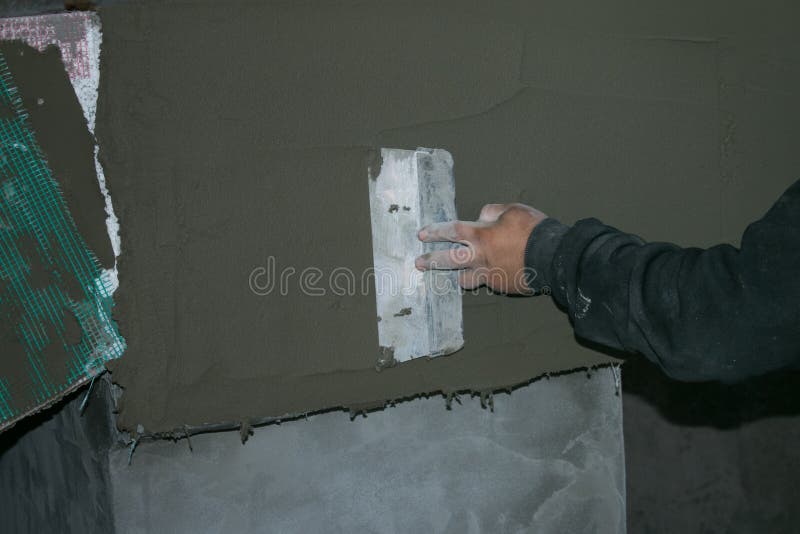 Building. Finishing Work. Plasterer Work. the Hand of the Master is ...