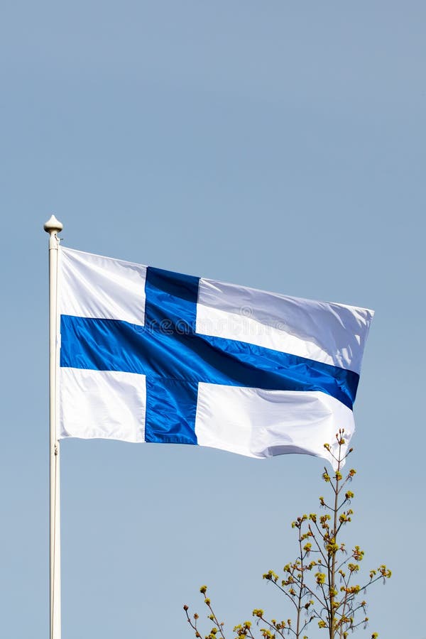 Finnish National Flag on the Wind Against the Blue Sky Stock Photo ...