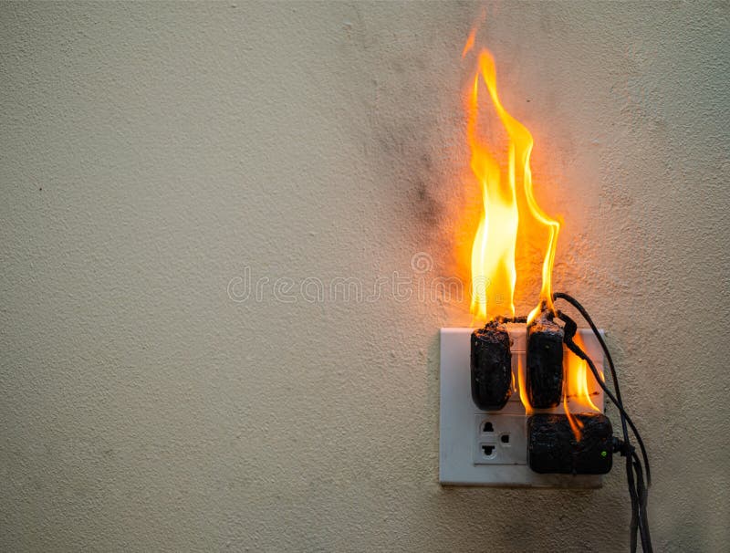 On Fire Adapter at Plug Receptacle on White Background Stock Photo ...