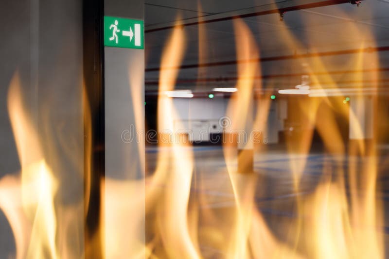 Fire Against Emergency Exit Sign Stock Photo - Image of danger ...