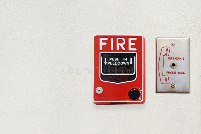 Fire Alarm Notifier and Fireman's Phone Jack on White Cement Plaster ...