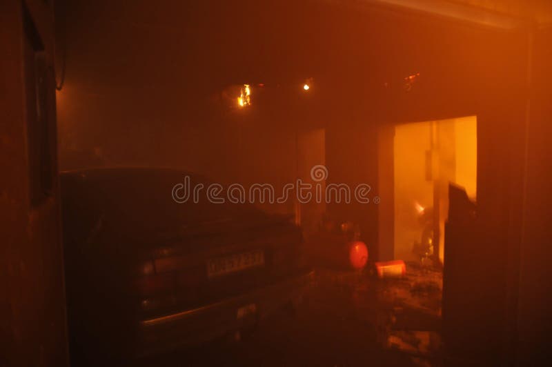 Fire in auto repair shop stock image. Image of firemen - 61798011
