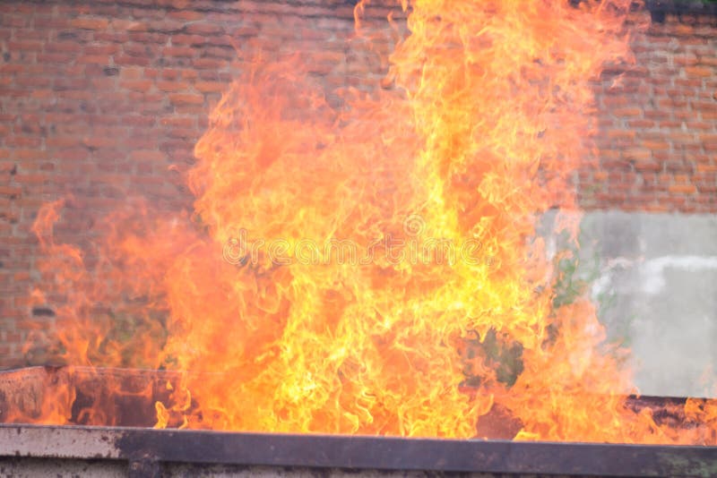 Fire on the Background of a Brick Wall Stock Photo - Image of backdrop ...