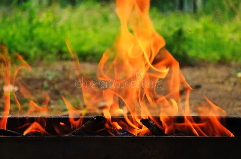 Fire on barbecue grill stock photo. Image of flames, heat - 72845028