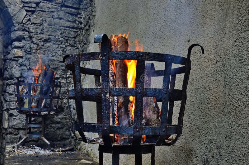 Fire in a fire basket stock image. Image of danger, flames - 162581379