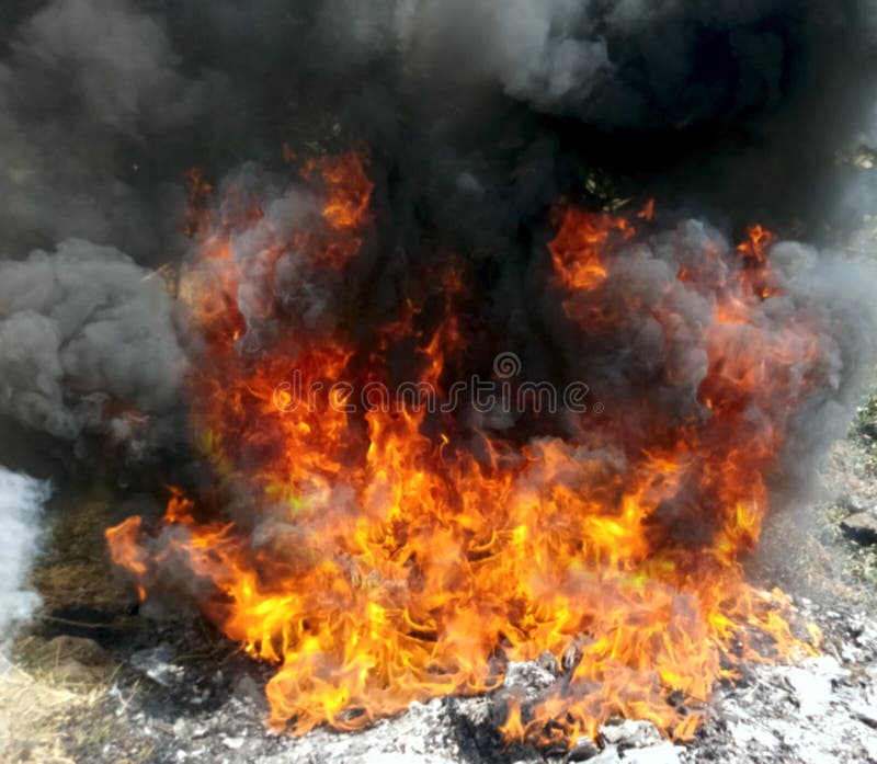 Fire Blaze and Flame Texture Background. Fire with Black Smoke Dust and ...