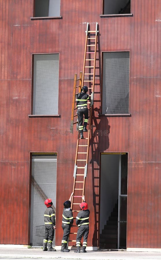 Fire Brigade Team Performing an Exercise in Using the Stairs To Stock ...
