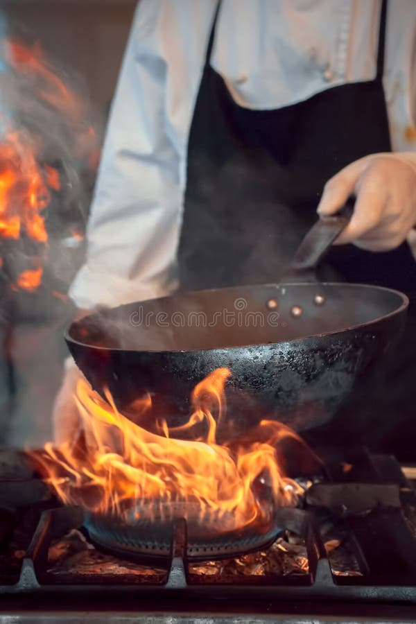 Fire Burn, Cooking on Iron Pan Stock Photo - Image of saute, flaming ...