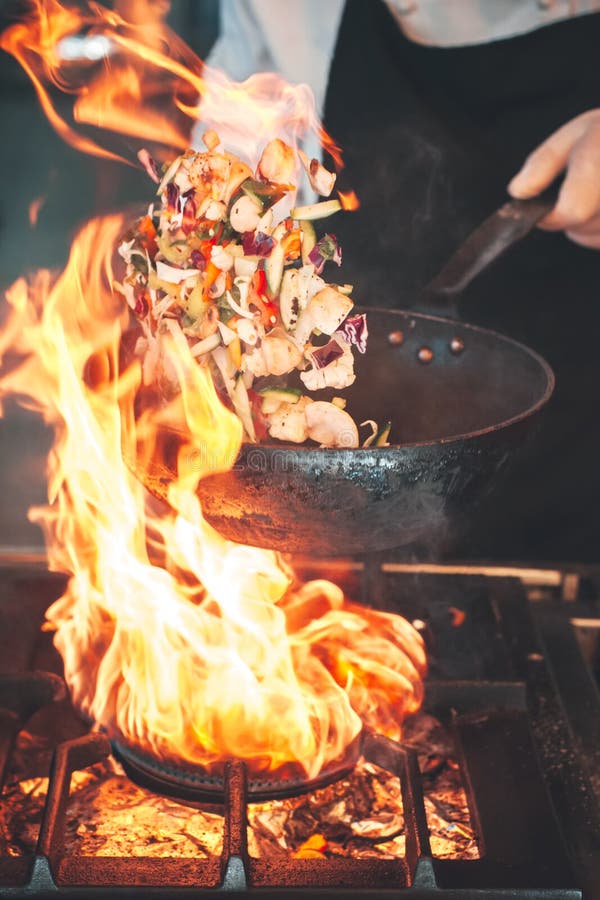 Fire Burn, Cooking on Iron Pan Stock Photo - Image of saute, preparing ...