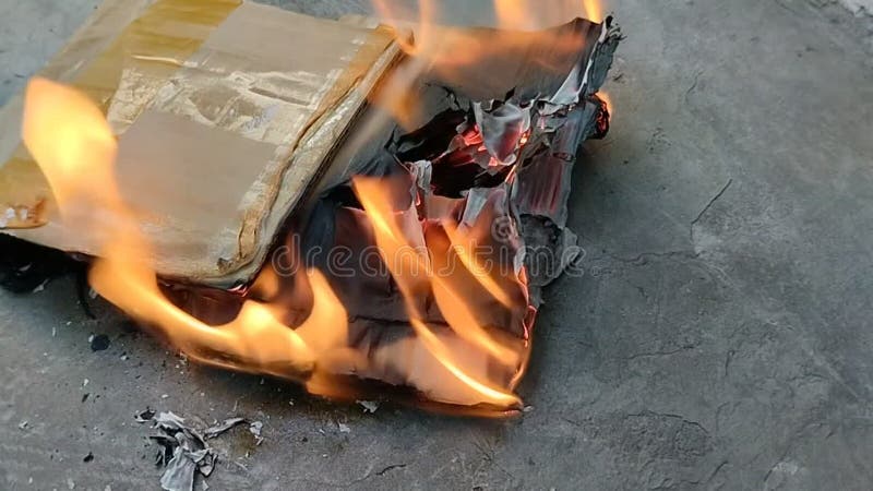 Fire burning cardboard stock video. Video of advertisement - 333298555