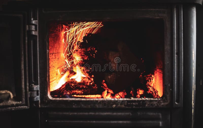 Fire Burning Glowing in Rustic Wood Burning Cast Iron Stove, Log Burner ...