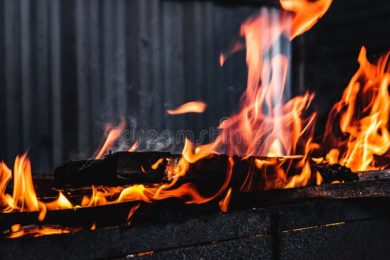 Fire burning on the grill stock image. Image of cooking - 103120763