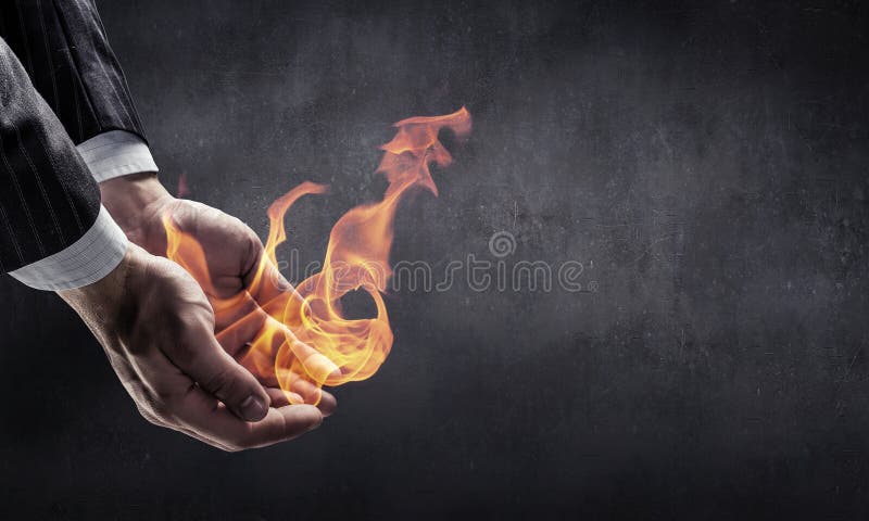 Fire burning in his hands stock photo. Image of global - 97269654