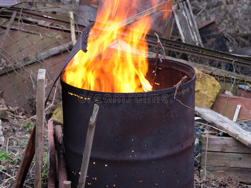 Fire Burning Inside an Old Rusty Barrel Outdoors Stock Image - Image of ...