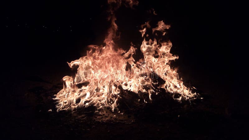 A Fire Burning in the Pitch Black Darkness Where Red Flames Appear ...