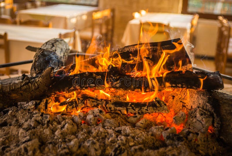 Fire Burning in Round Central Fireplace Stock Image - Image of indoors ...