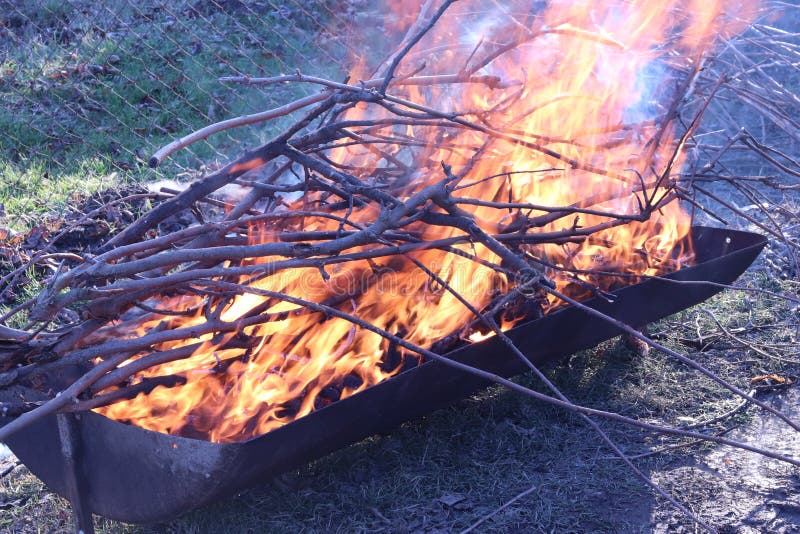 A Fire is Burning in a Tin Trough Stock Photo - Image of soil, iron ...