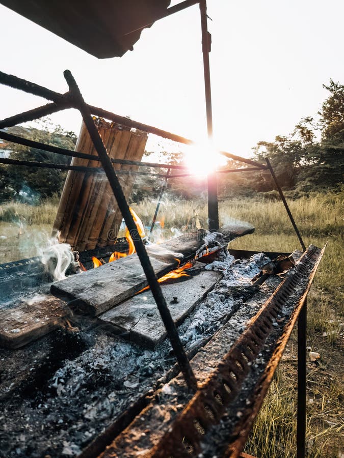 Fire Burning the Wood while Cooking Lemang on the Sunset Stock Photo ...