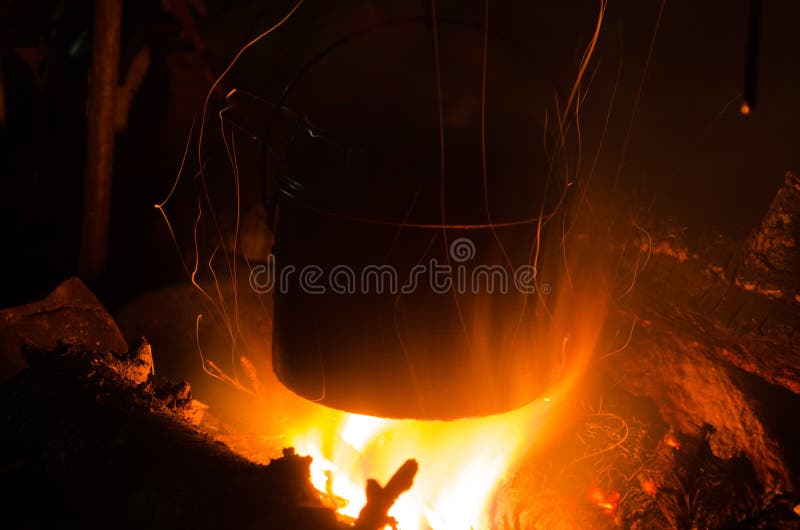 Fire Burns in the Campaign. Pot of Tea by the Fire Stock Image - Image ...
