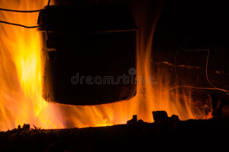 Fire Burns in the Campaign. Pot of Tea by the Fire Stock Image - Image ...