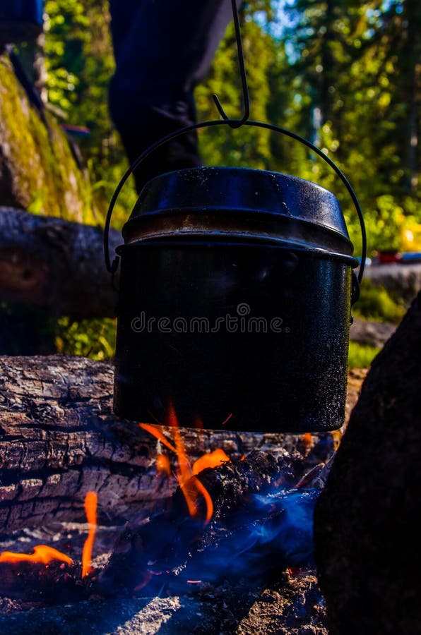 Fire Burns in the Campaign. Pot of Tea by the Fire Stock Image - Image ...