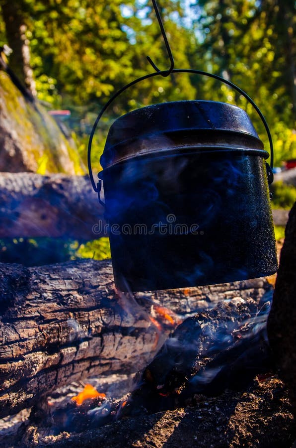 Fire Burns in the Campaign. Pot of Tea by the Fire Stock Image - Image ...