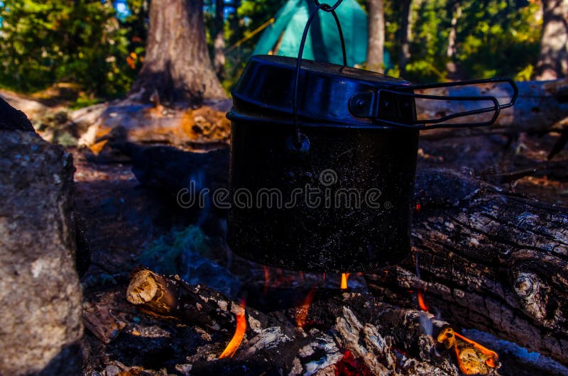 Fire Burns in the Campaign. Pot of Tea by the Fire Stock Image - Image ...