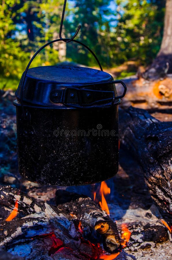 Fire Burns in the Campaign. Pot of Tea by the Fire Stock Image - Image ...