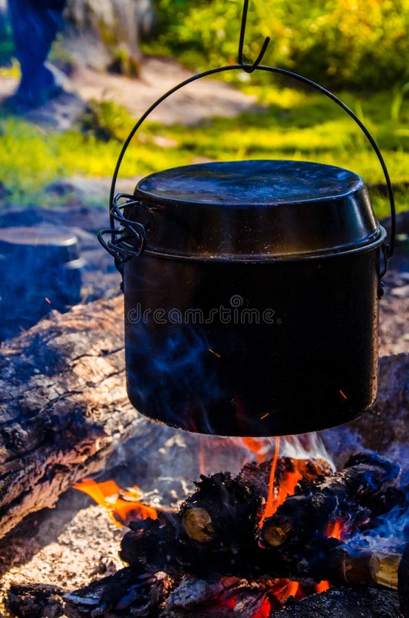 Fire Burns in the Campaign. Pot of Tea by the Fire Stock Photo - Image ...
