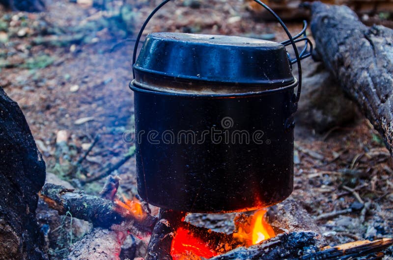 Fire Burns in the Campaign. Pot of Tea by the Fire Stock Image - Image ...
