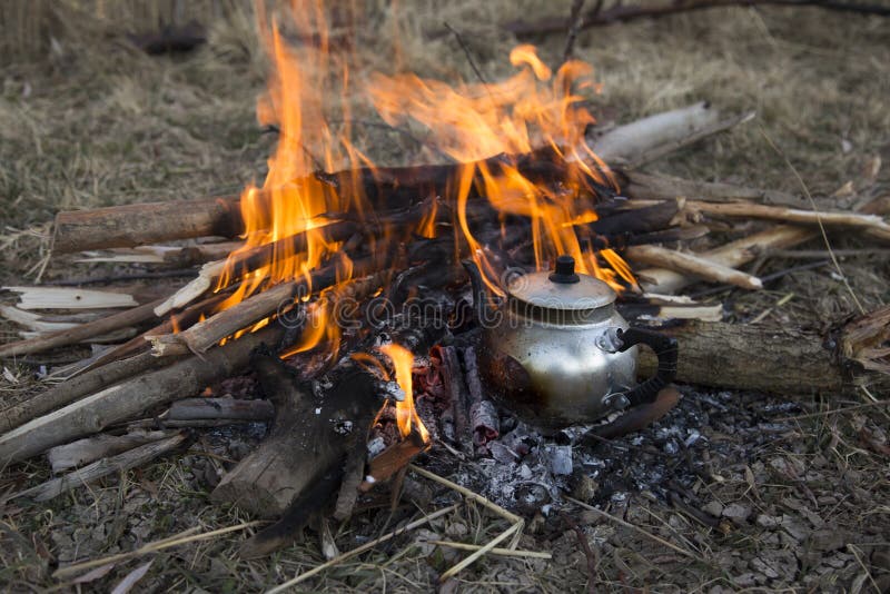 Fire Burns in the Campaign, Pot of Tea by the Fire Stock Image - Image ...