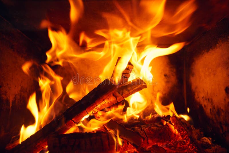 A Fire Burns in a Fireplace, Fire To Keep Warm. Logs Burning in a ...