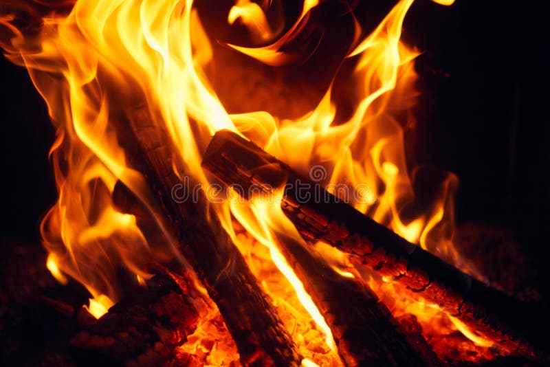 A Fire Burns in a Fireplace, Fire To Keep Warm. Logs Burning in a ...