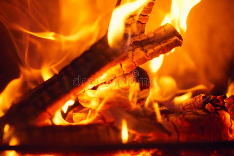 A Fire Burns in a Fireplace, Fire To Keep Warm. Logs Burning in a ...