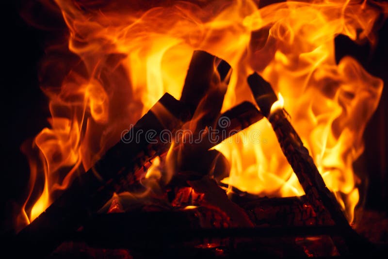 A Fire Burns in a Fireplace, Fire To Keep Warm. Logs Burning in a ...