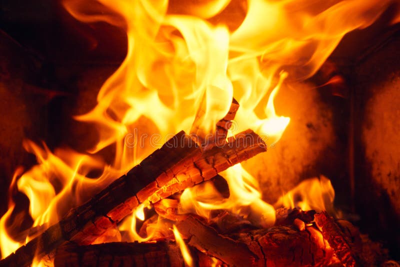 A Fire Burns in a Fireplace, Fire To Keep Warm. Logs Burning in a ...